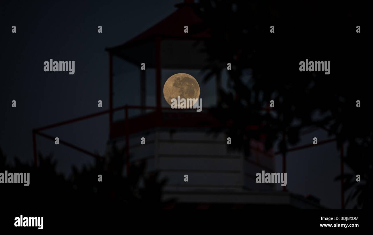 Moon through lighthouse hi-res stock photography and images - Alamy