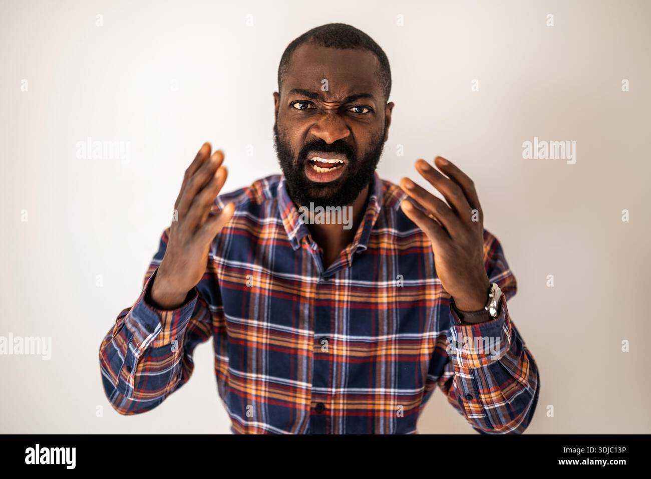 Portrait of emotionally stressed and angry black man who is arguing ...