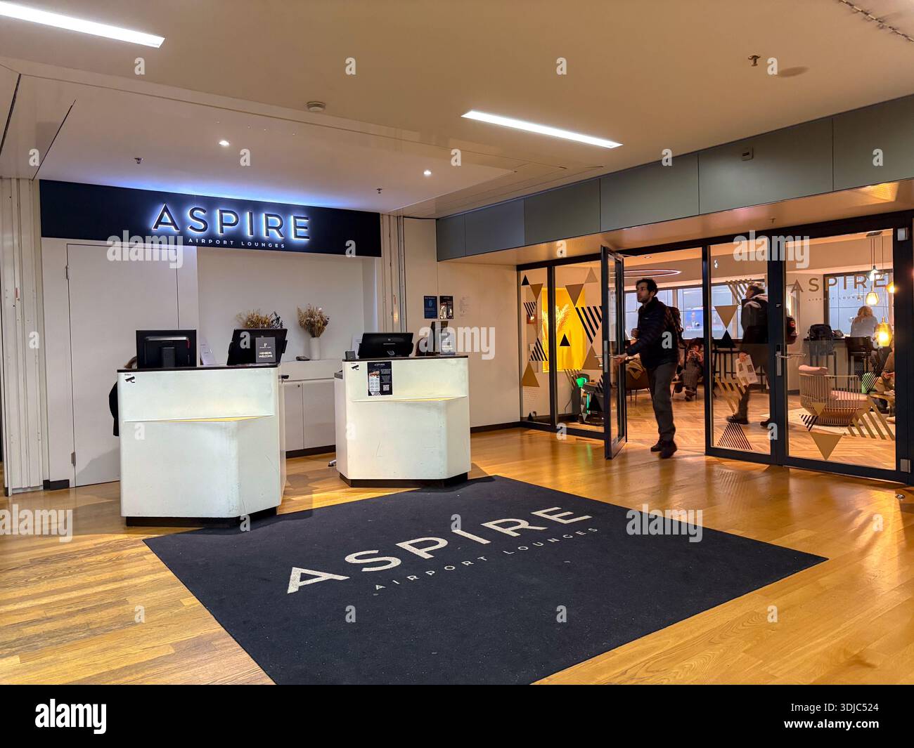 Aspire Airport Lounges reception desk and entrance. Modern airport ...