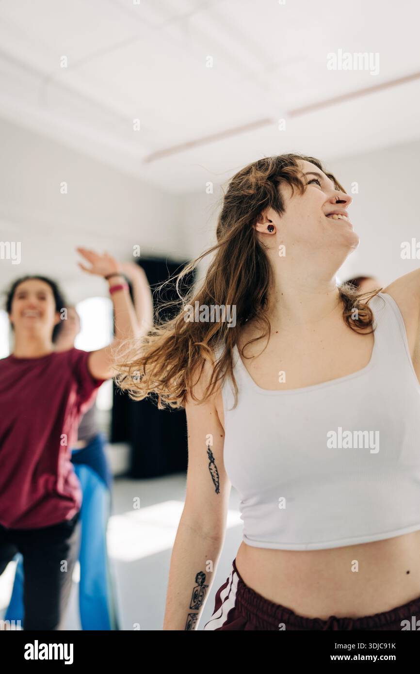 Diverse group smiling friends dancing hi-res stock photography and ...