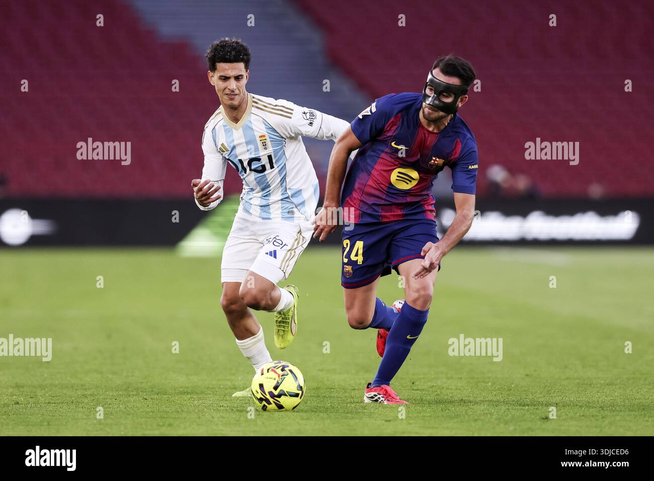 Eric Garcia of FC Barcelona and Ilyas Chaira of Real Oviedo during the ...