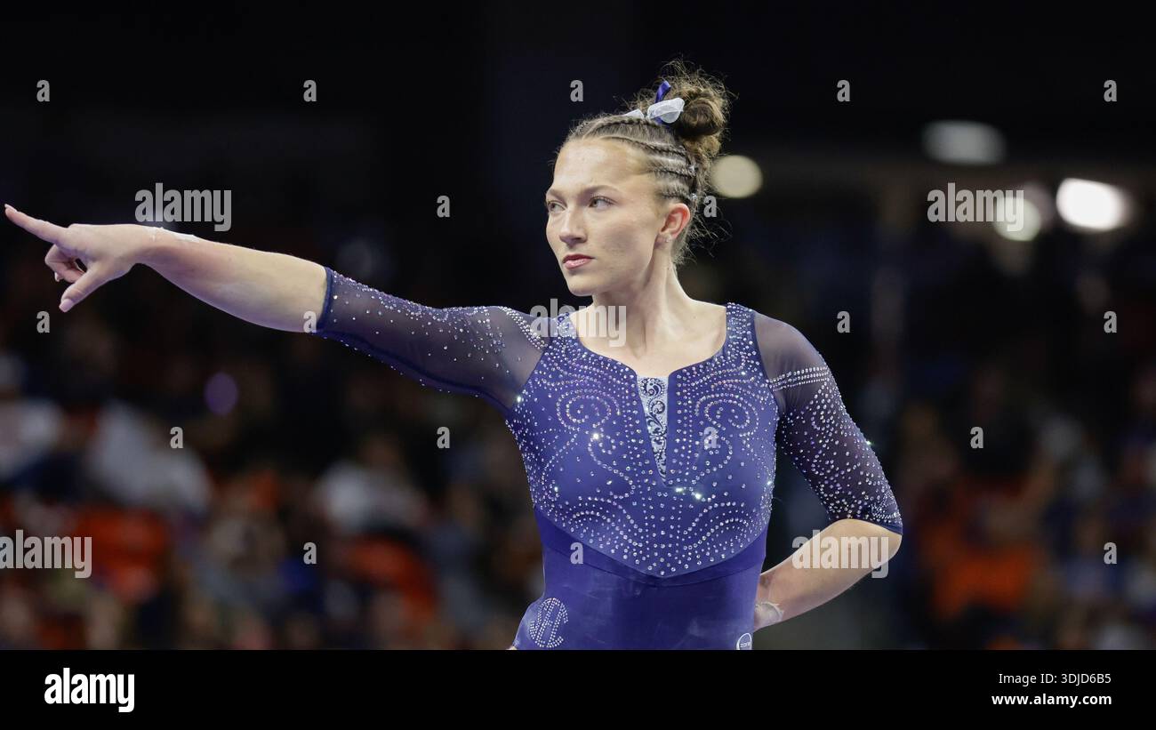 Auburn's Alex Irvine competes on the balance beam during an NCAA ...