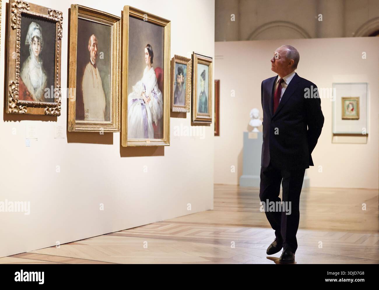 Russian President Vladimir Putin looks at the painting during a tour in ...