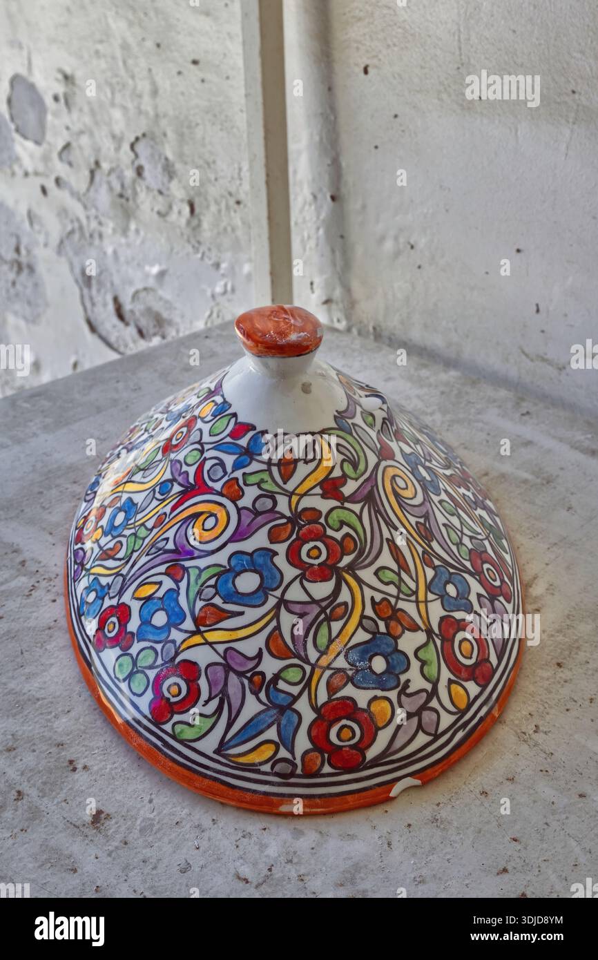 Isolated glazed, hand painted in arabesque colorful motifs tagine pot ...
