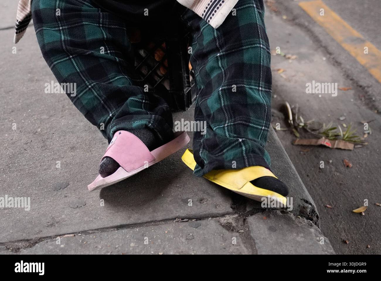 Victor Tate, who described himself as homeless, sits at an intersection ...