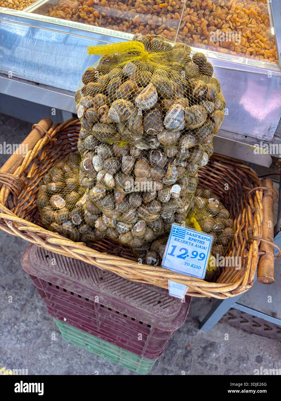 Edible snails in bags at an Athens market. Greek cuisine, escargots ...