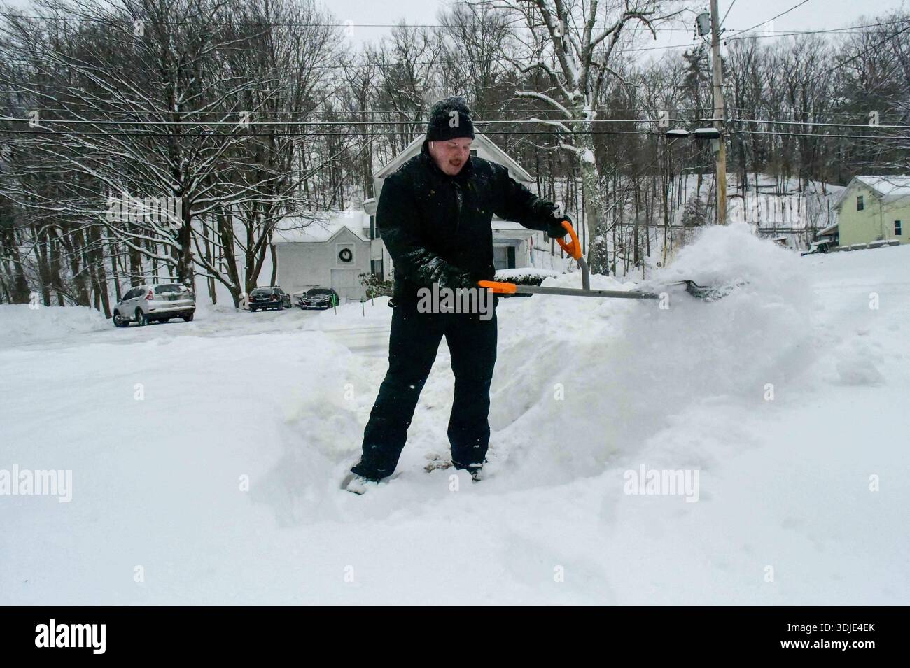 Brandon Sherwood shovels his walkway on Route 121 on Monday, Jan. 26 ...
