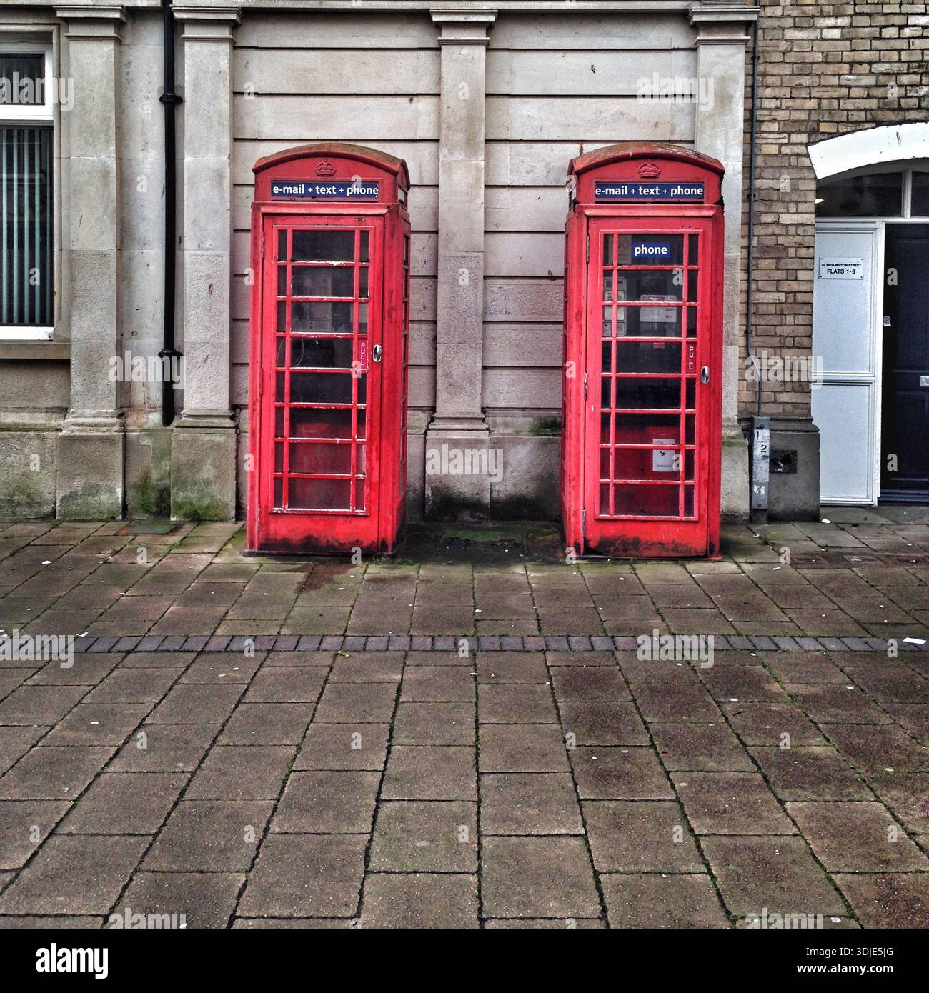 2 classic red phone boxes in Teignmouth, Devon, UK. The red telephone ...