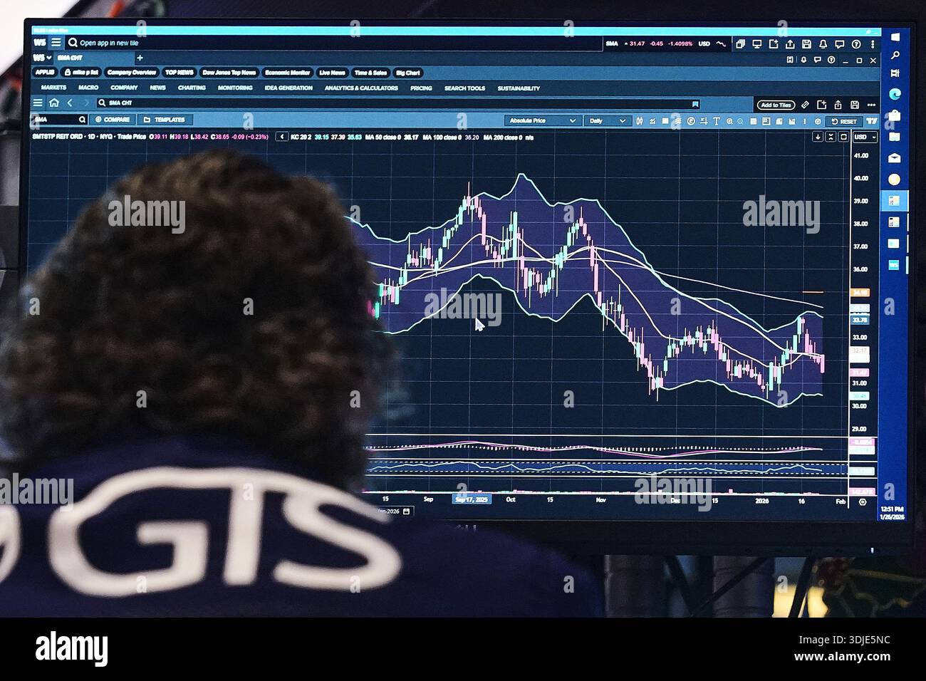 Specialist Michael Pistillo works at his post on the floor of the New ...