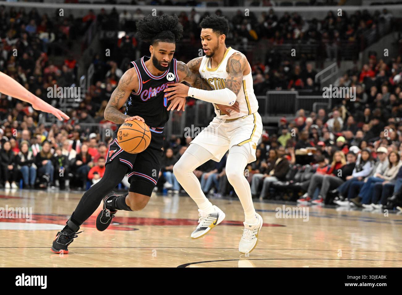 Chicago Bulls guard Coby White, left, dribbles against Boston Celtics ...
