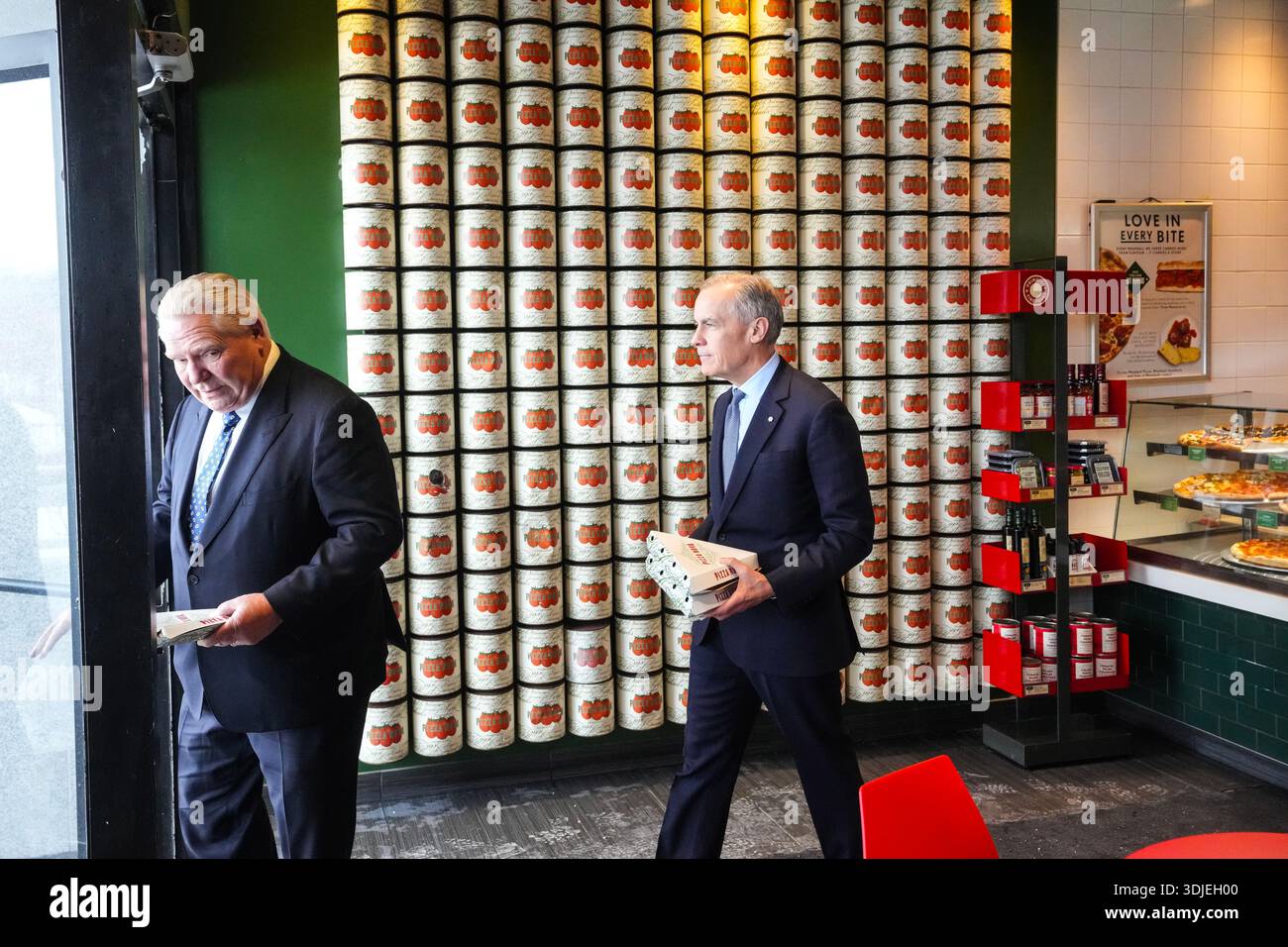 Prime Minister Mark Carney and Ontario Premier Doug Ford leave a local ...