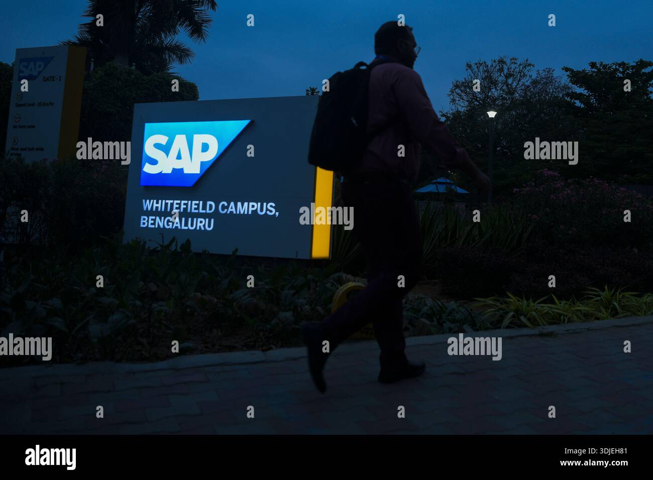 A person passes by an SAP office in Bengaluru, Karnataka, India ...