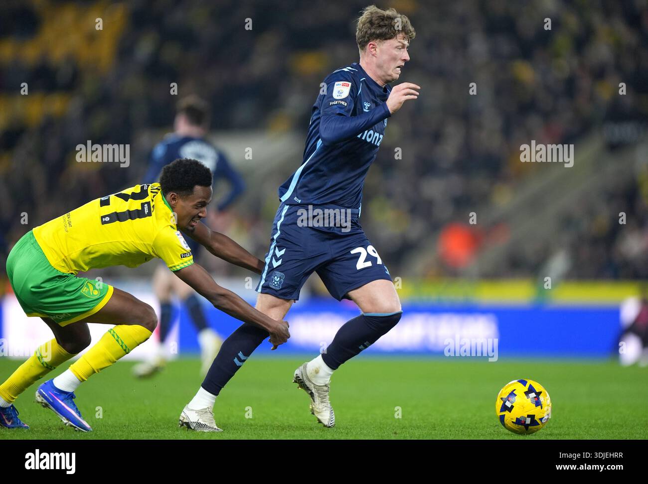 Coventry City's Victor Torp and Norwich City's Ali Ahmed battle for the ...