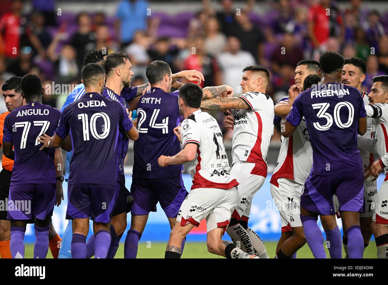 Orlando City players left, and Atlas players argue during the first ...