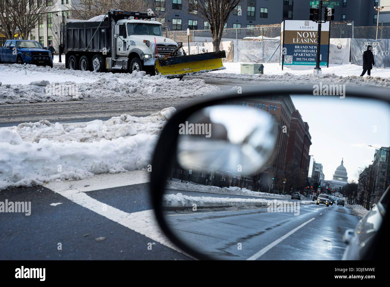 A snow plow in downtown the day after a major winter storm in ...