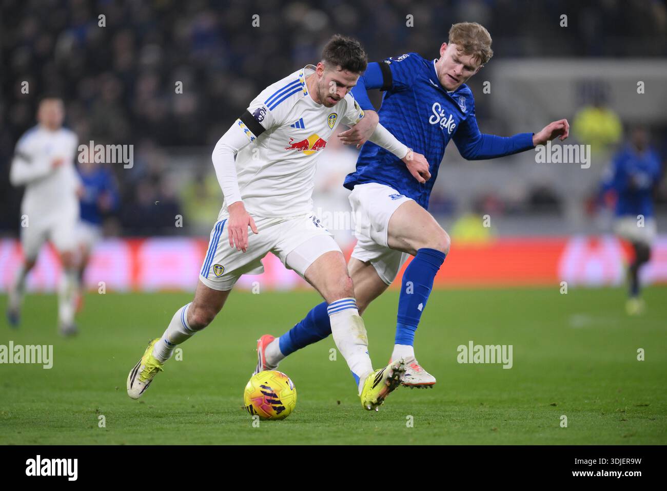 Leeds United's Anton Stach and Everton's Jarrad Branthwaite compete ...