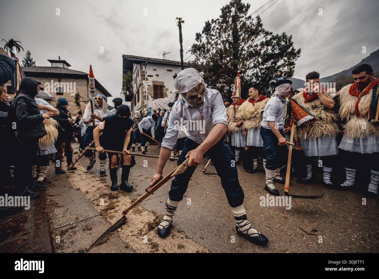 Ituren, Spain. 26 January, 2026: Revelers wearing grotesque masks ...