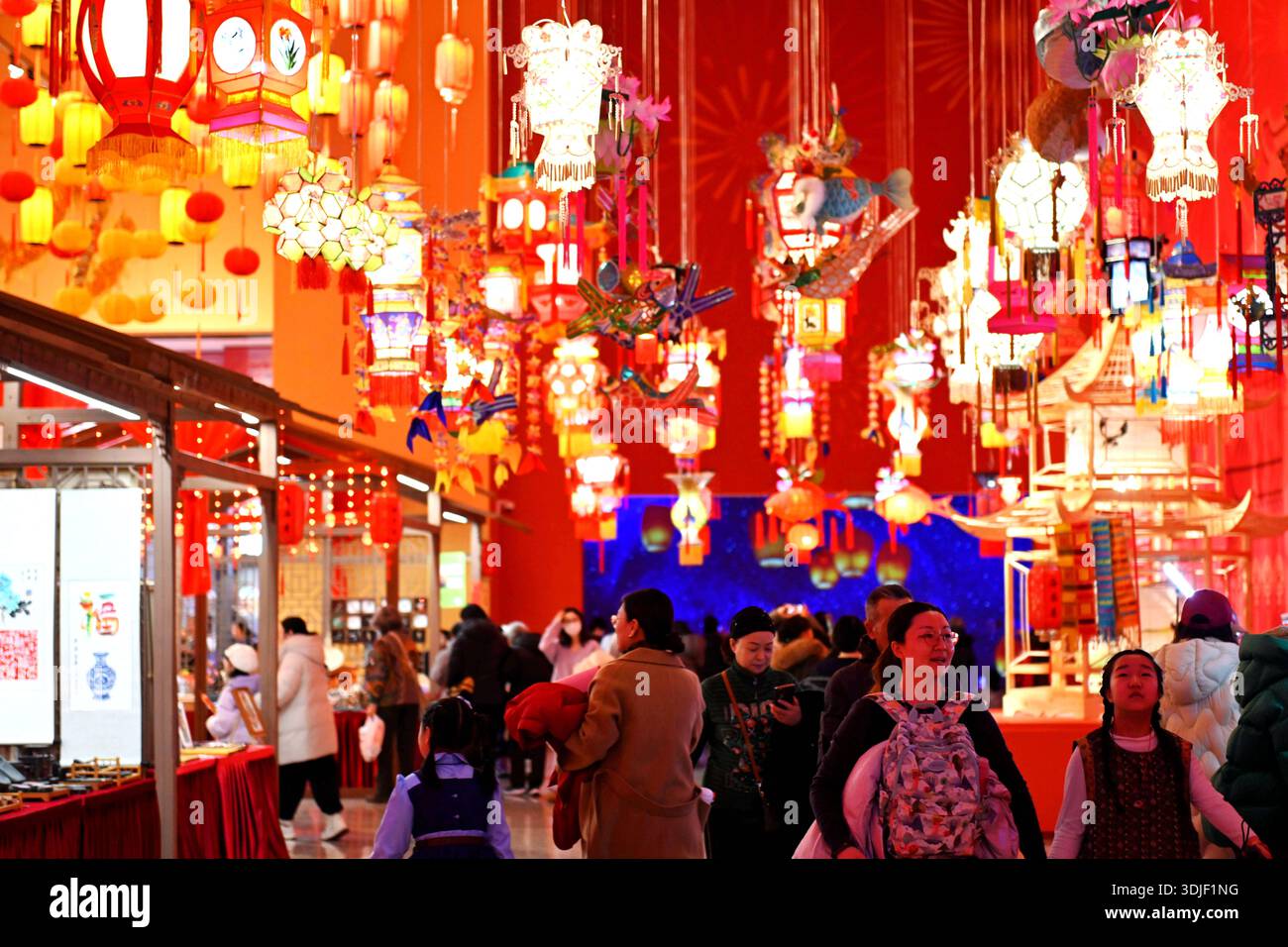 BEIJING, CHINA - JANUARY 26, 2026 - Visitors watch an exhibition of ...
