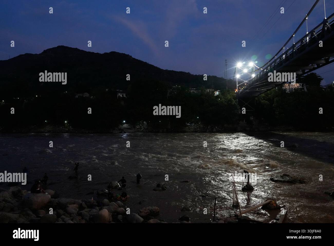 People fish during an annual phenomenon of fish swimming upstream to ...