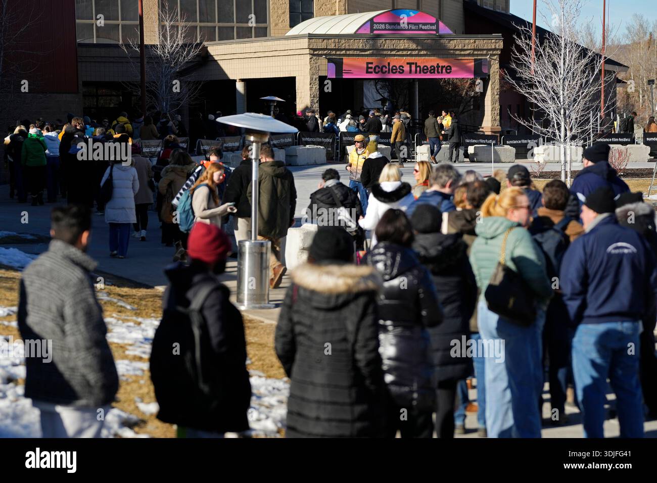Audience members line up outside the Eccles Theatre during the Sundance ...