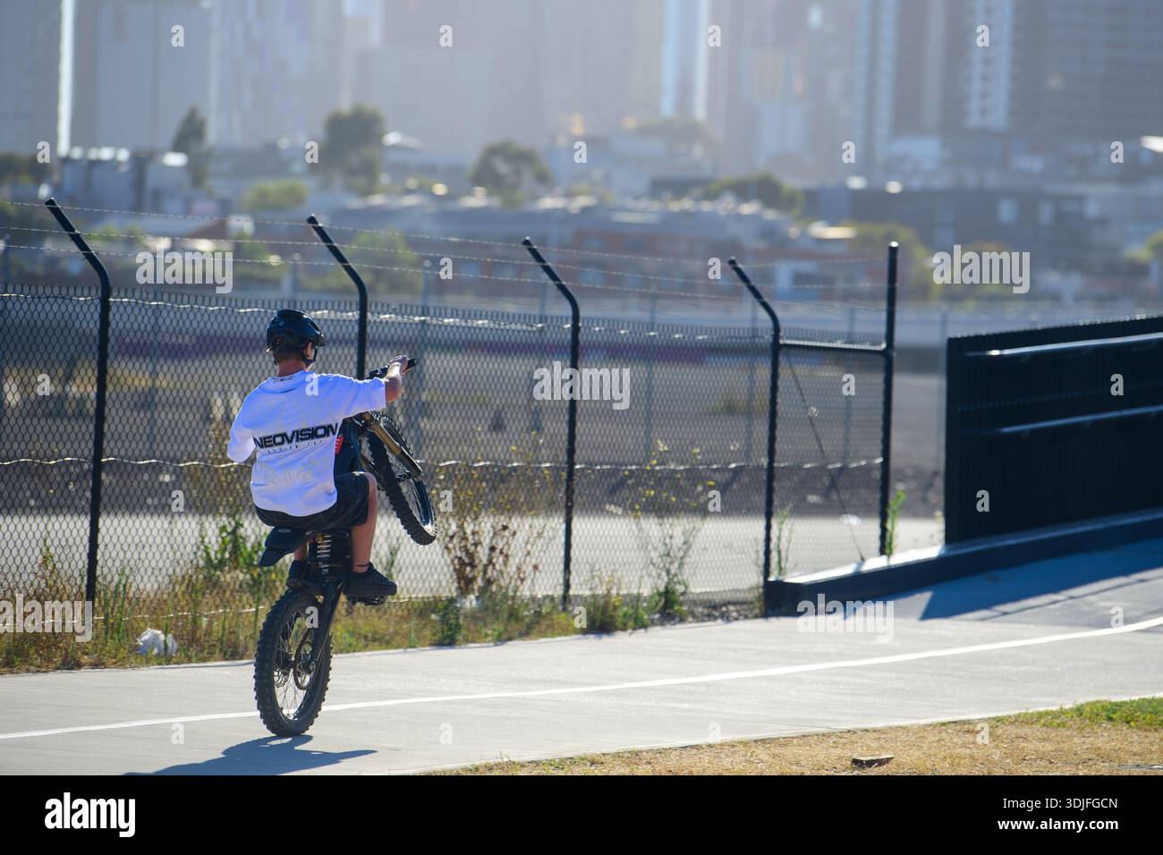 A young rider zooms towards the city to beat the heat in Melbourne ...