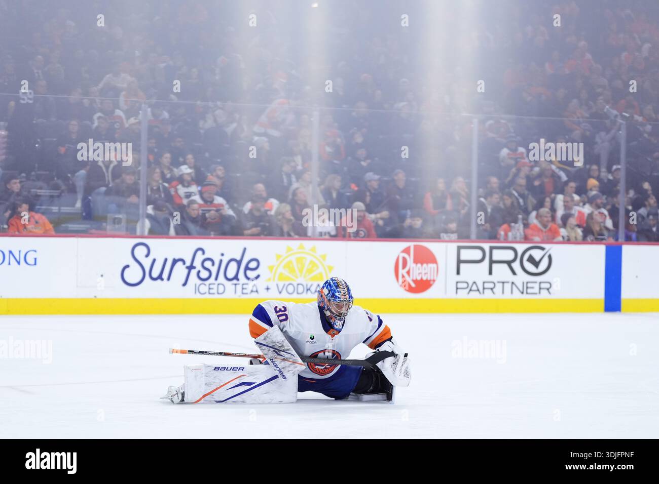 New York Islanders' Ilya Sorokin stretches during an NHL hockey game ...