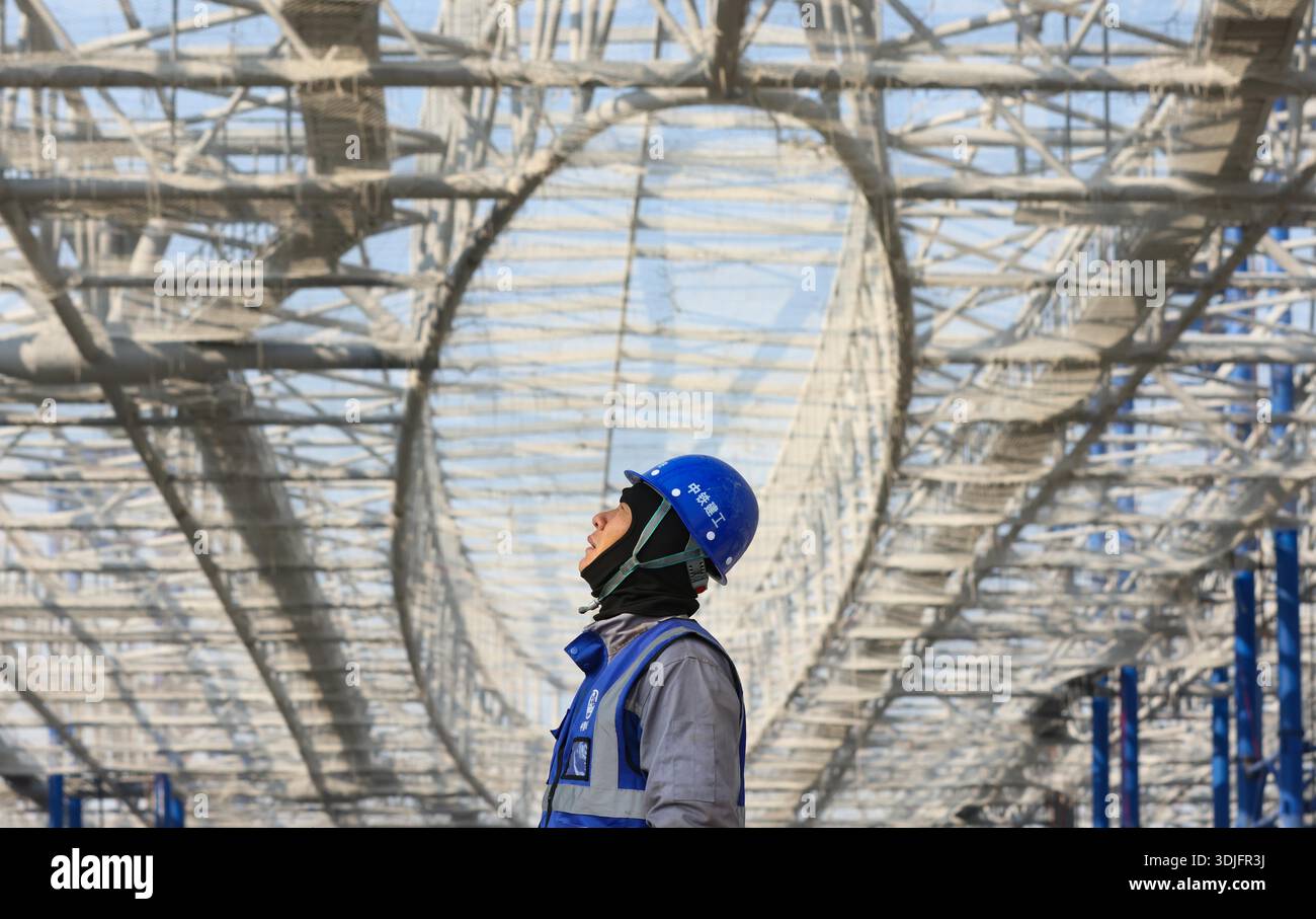 **CHINESE MAINLAND, HONG KONG, MACAU AND TAIWAN OUT**Workers construct ...