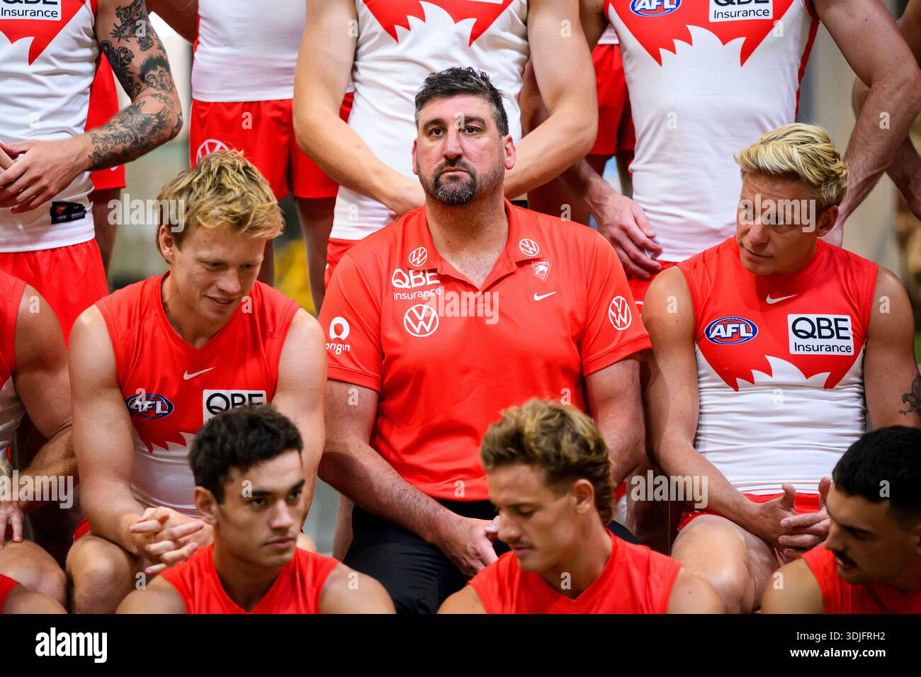 Swans coach Dean Cox (centre) poses for a photograph during Sydney ...