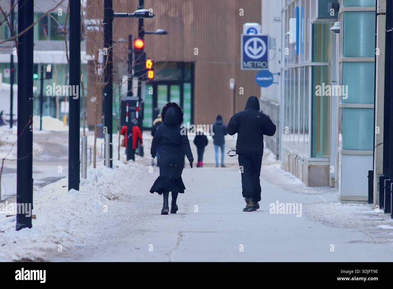 Persons are seen walking over streets covered in snow. A polar vortex ...