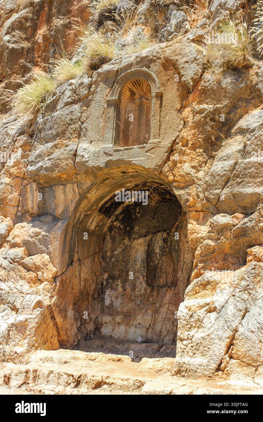 This ancient rock-hewn recessed niche was made to hold a shrine to a ...