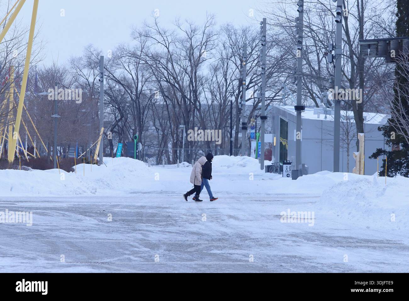 Persons are seen walking over streets covered in snow. A polar vortex ...