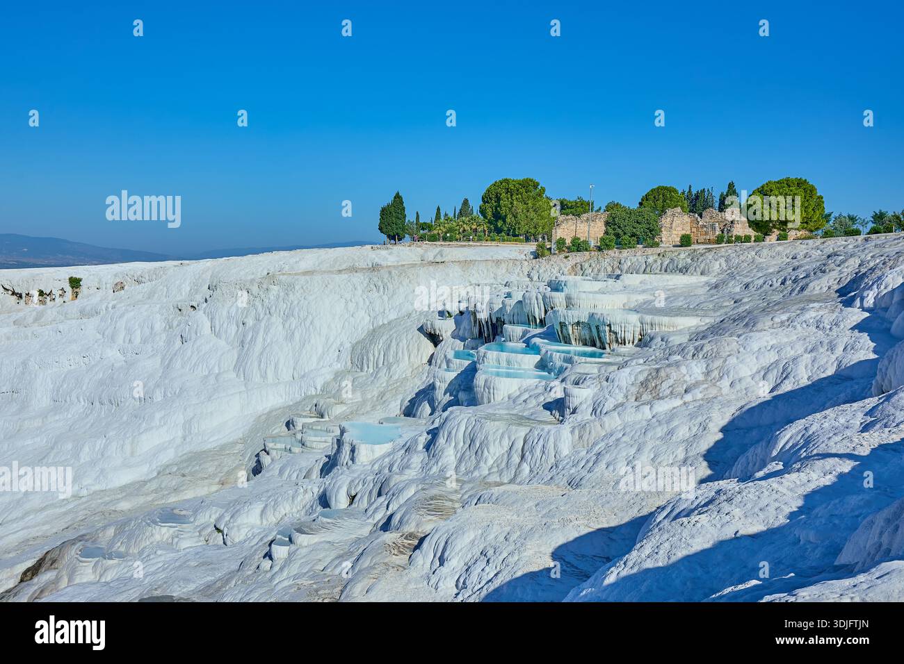 Pamukkale pools is waters from ancient hot springs that spill down the ...