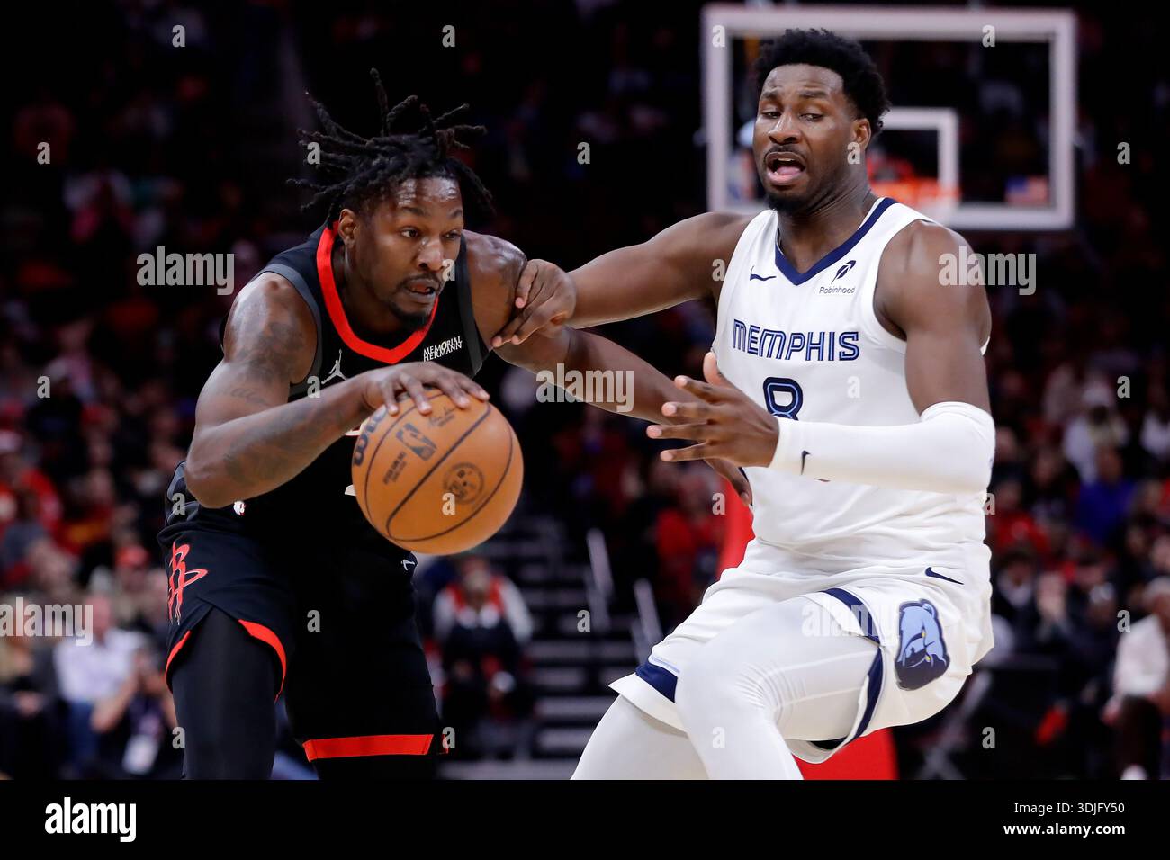 Houston Rockets forward Dorian Finney-Smith, left, drives around ...