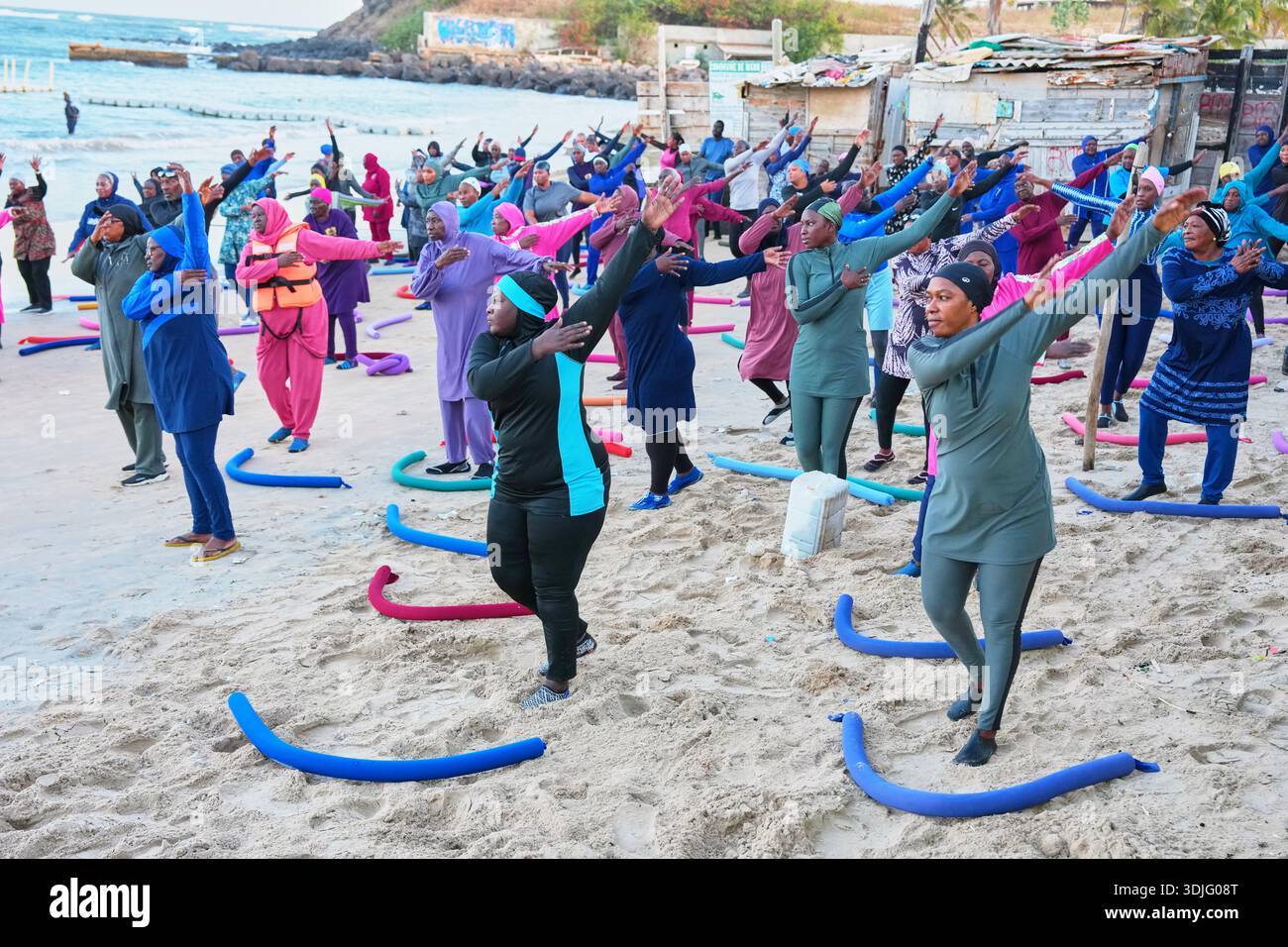 Participants warm up before the aquatic therapy session at the ...