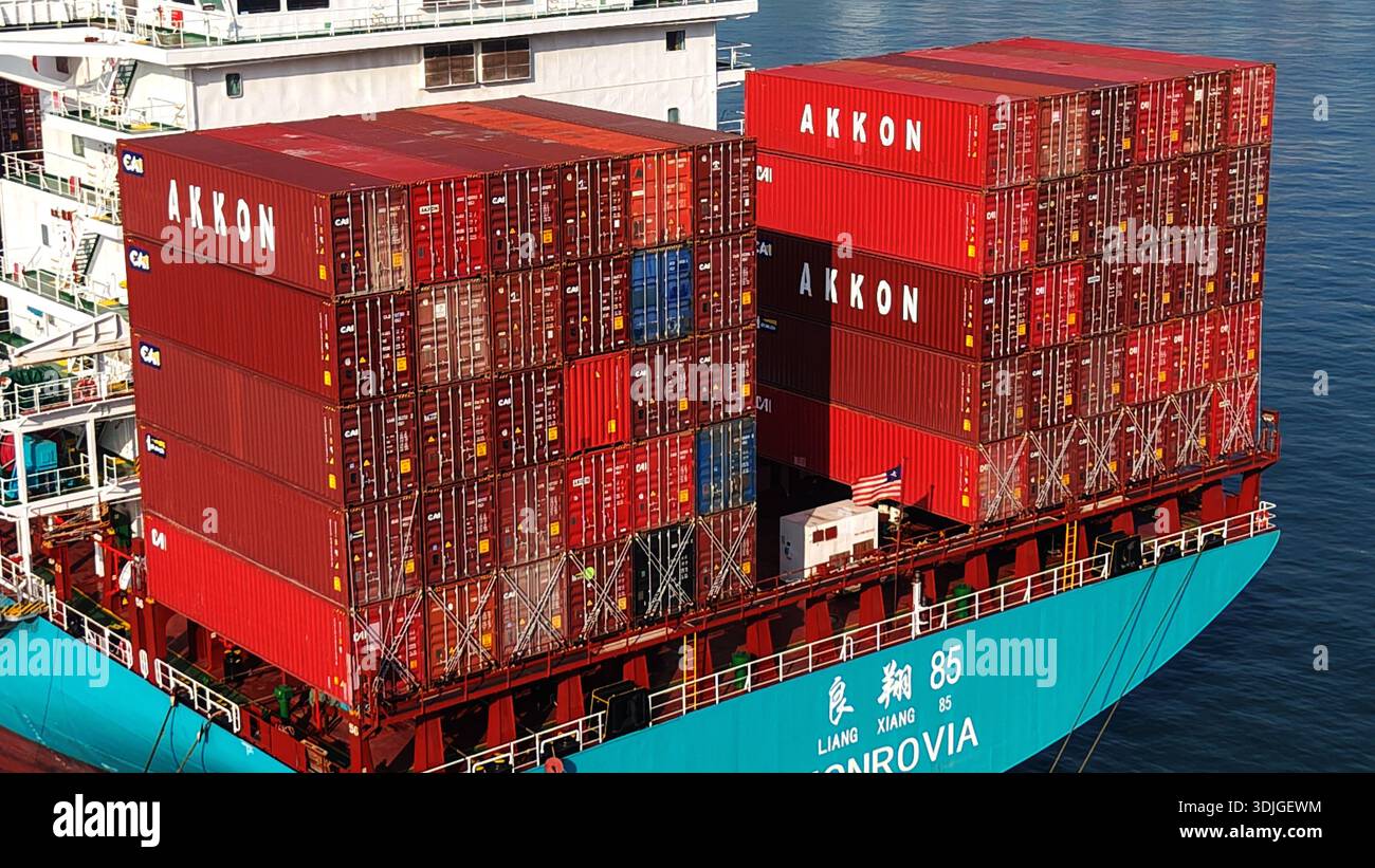 QINGDAO, CHINA - JANUARY 27, 2026 - A cargo ship is loading and ...