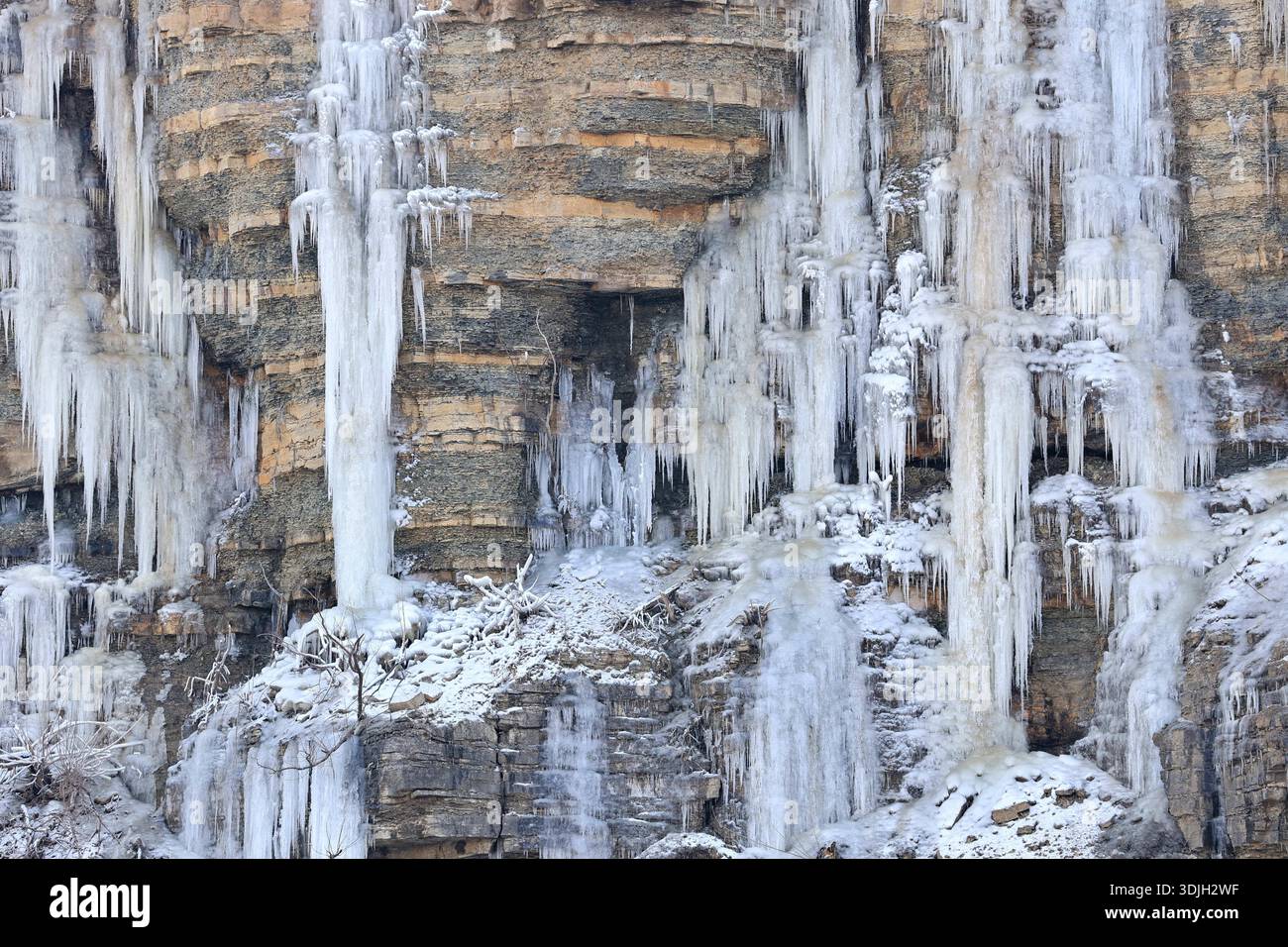 Ice formations decorate the cliffs in Yandi Village, Shanting District ...