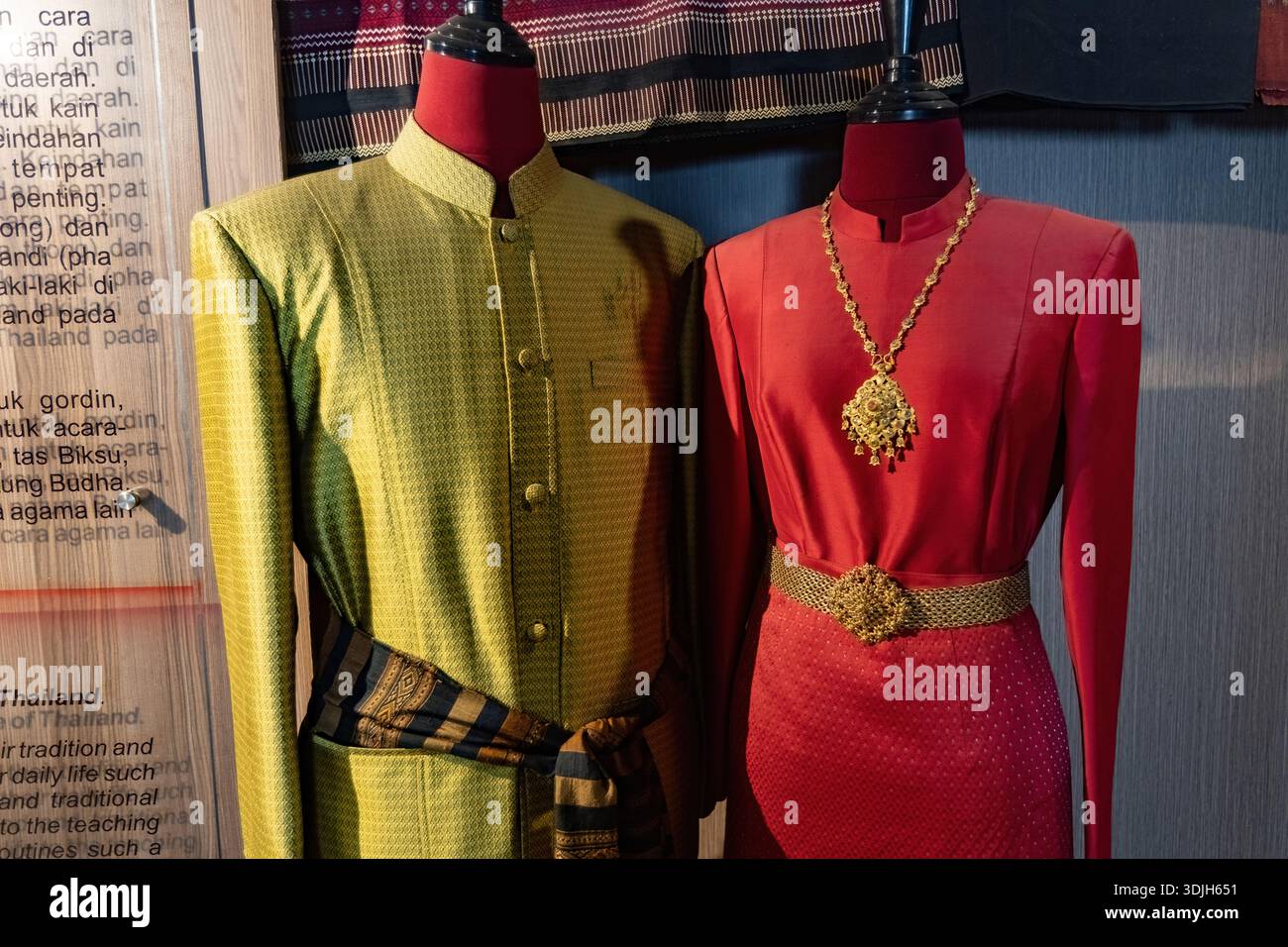 Traditional North Sumatra man's and woman's outfit samples in the State ...