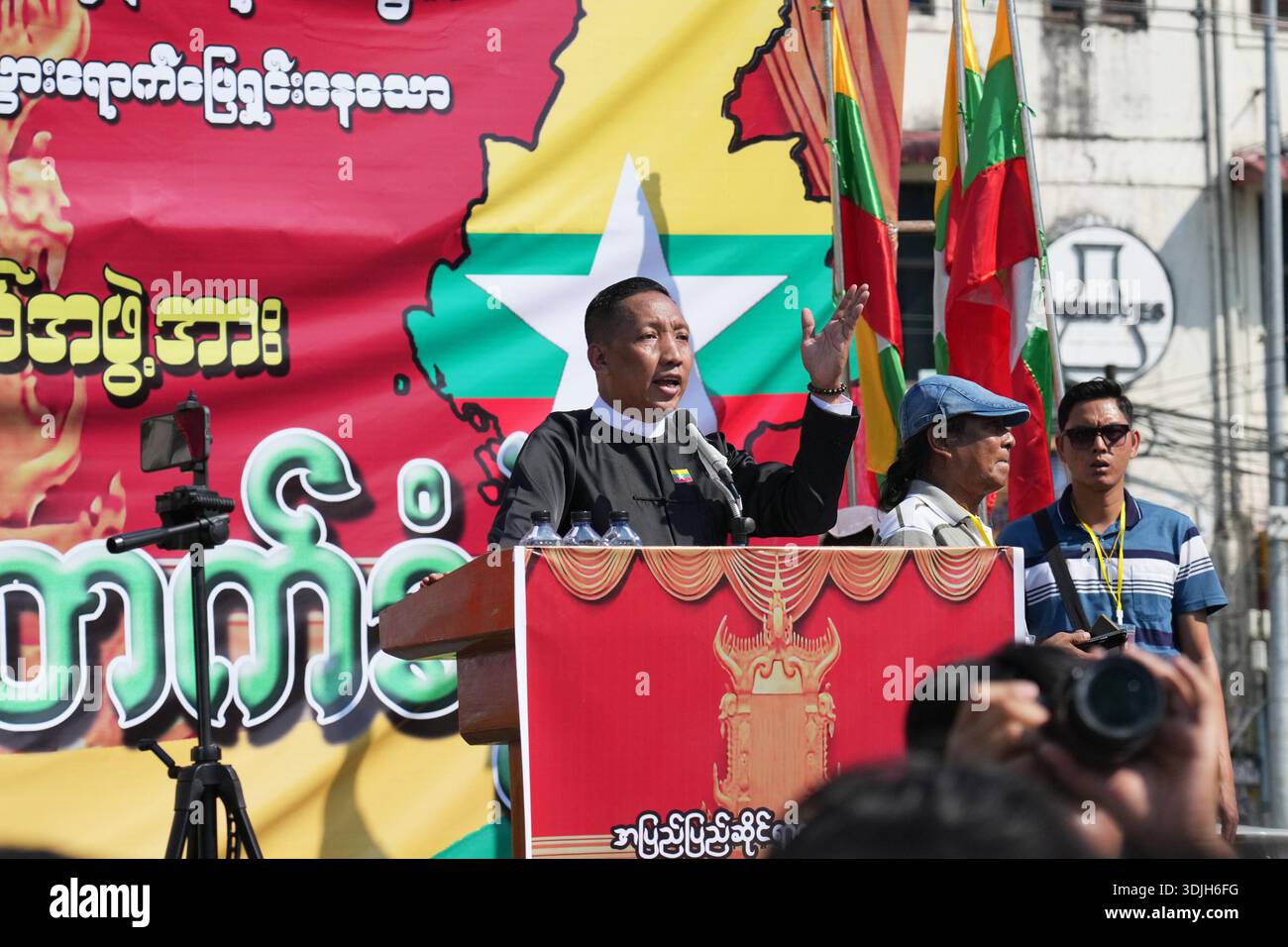 Myanmar nationalist Win Ko Ko Latt speaks on the stage during a rally ...