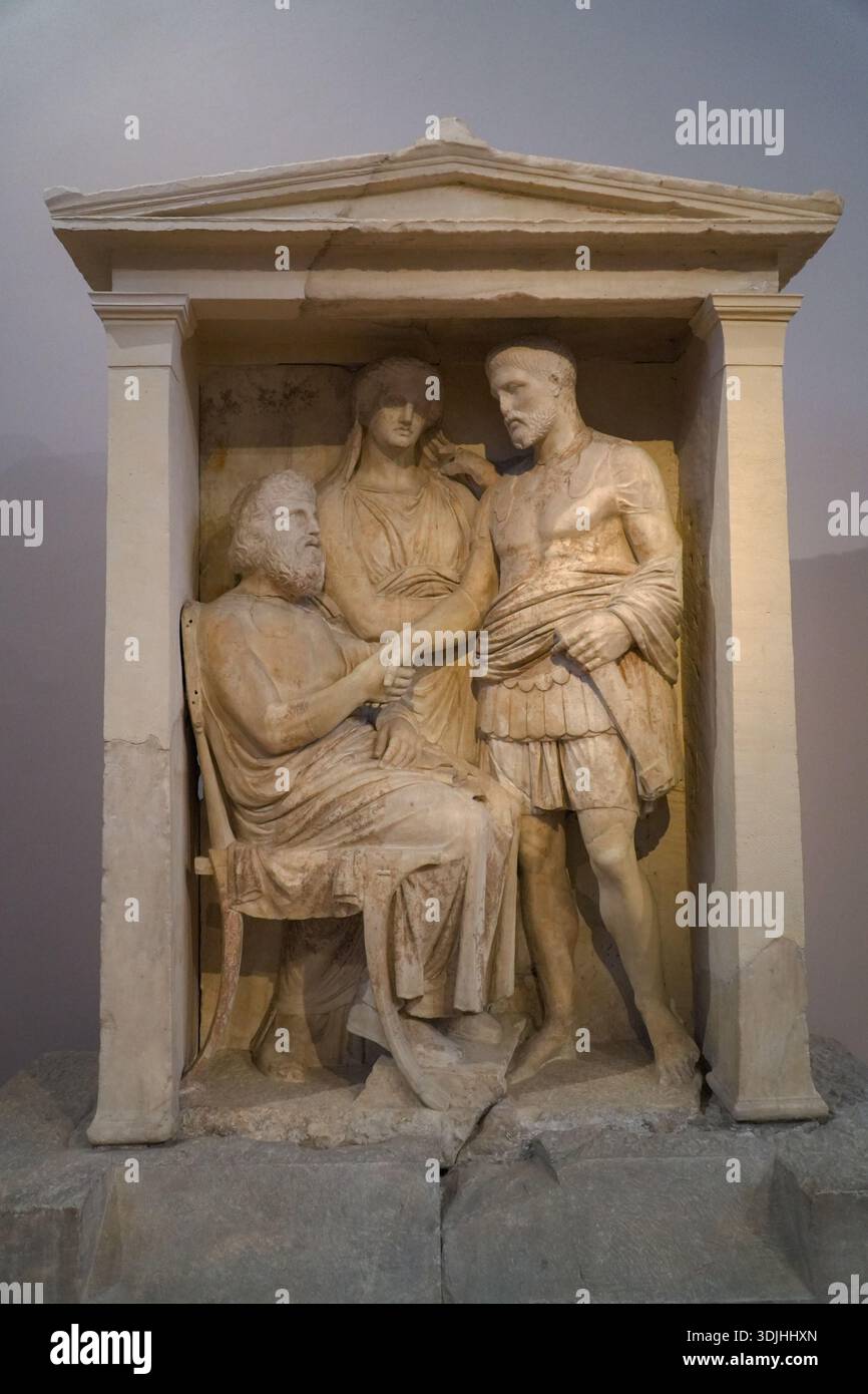 Ancient Greek marble funerary relief depicting a three-figure farewell ...