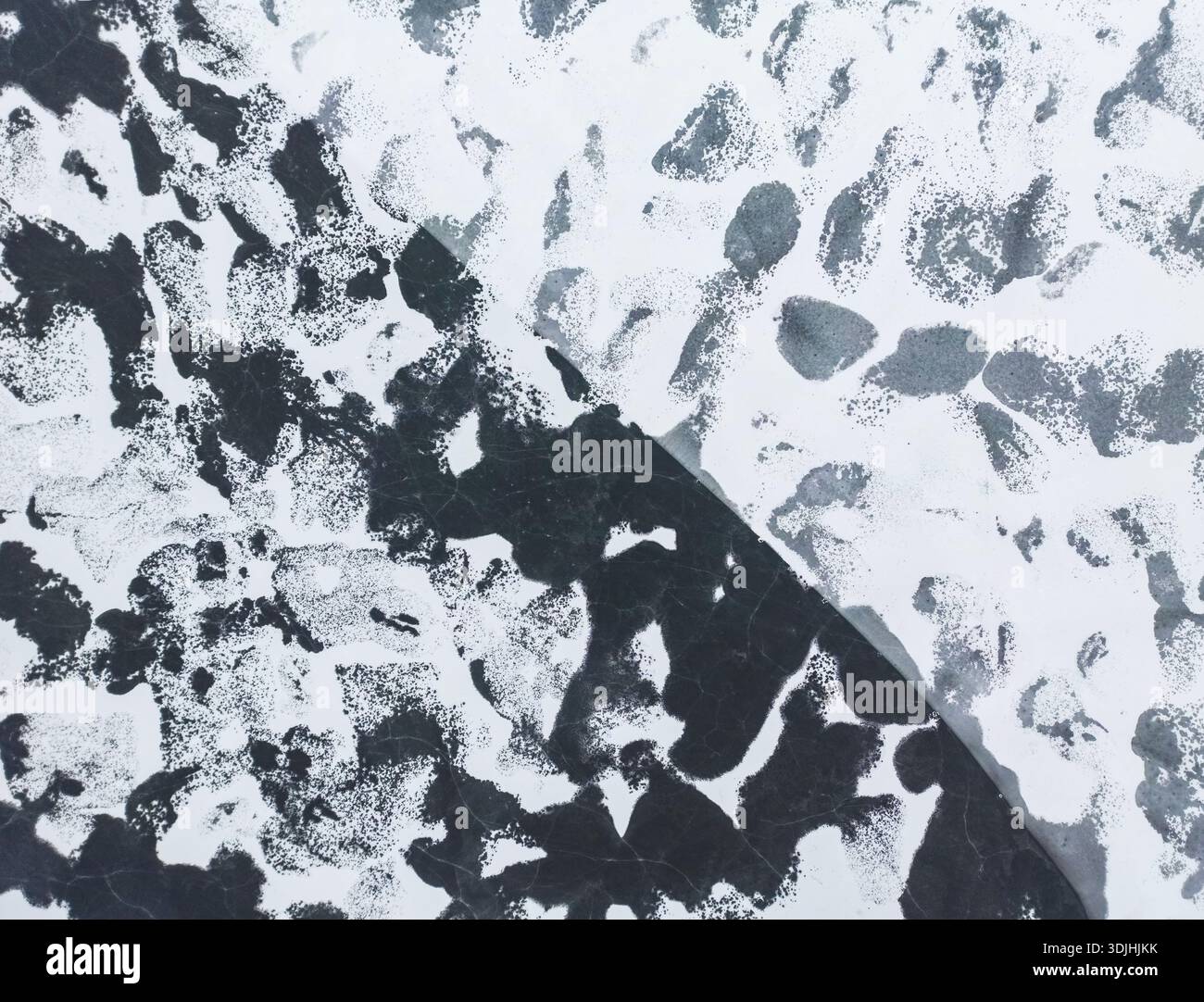 Treplin, Germany. 27th Jan, 2026. A little snow lies on the ice of the ...