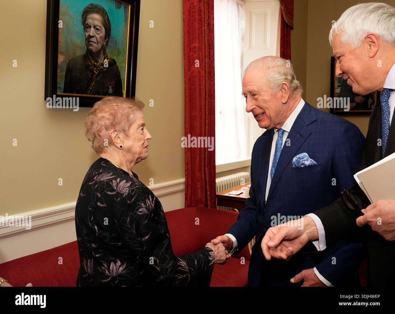 King Charles III speaks with Holocaust survivor Rachel Levy during a ...
