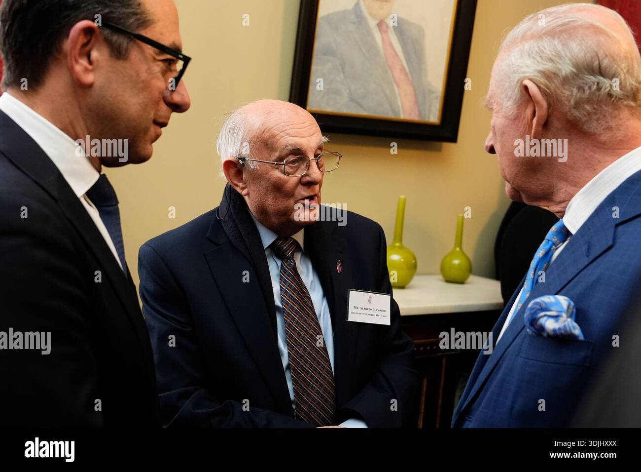 King Charles III speaks with Holocaust survivor Alfred Garwood during a ...