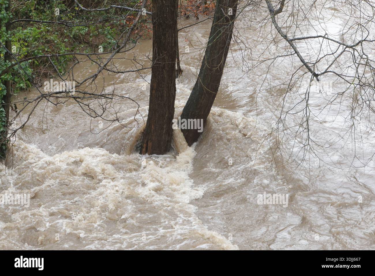 Dublin, Ireland - 27th January 2026: Fast flowing water surrounds a ...