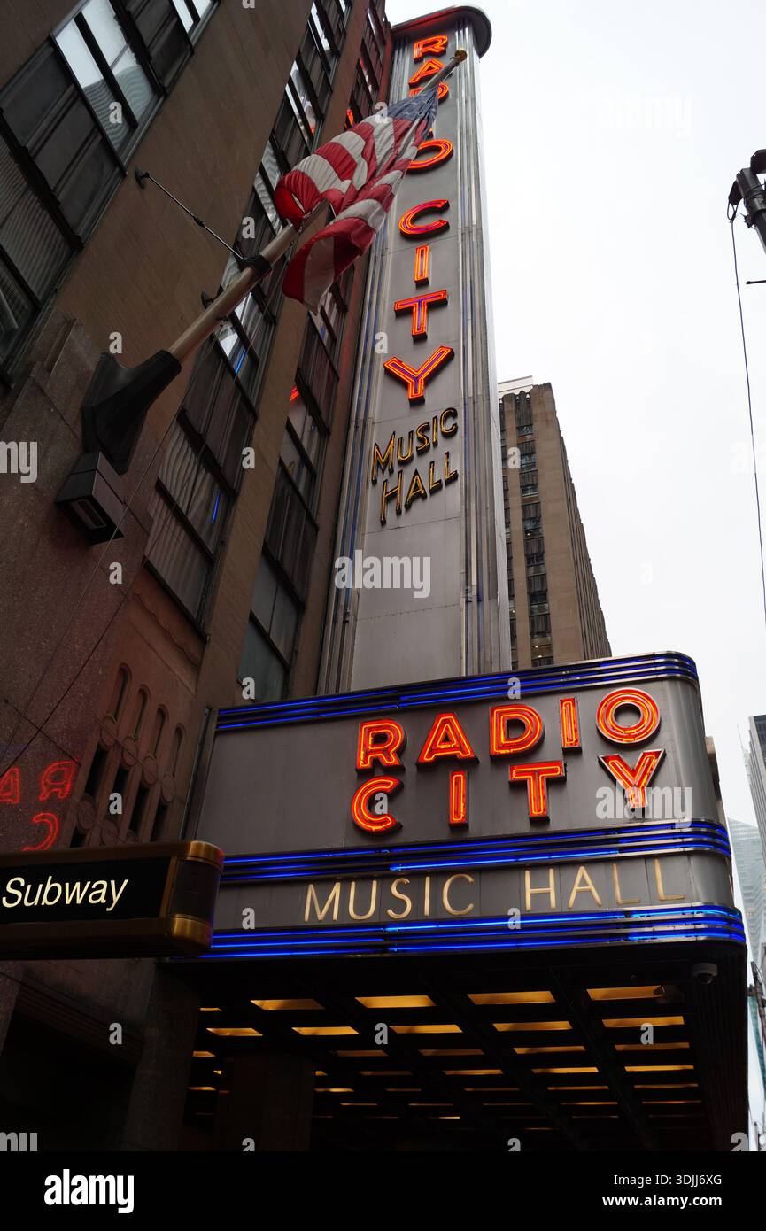 Radio City Music Hall marquee with American flag in Midtown Manhattan ...