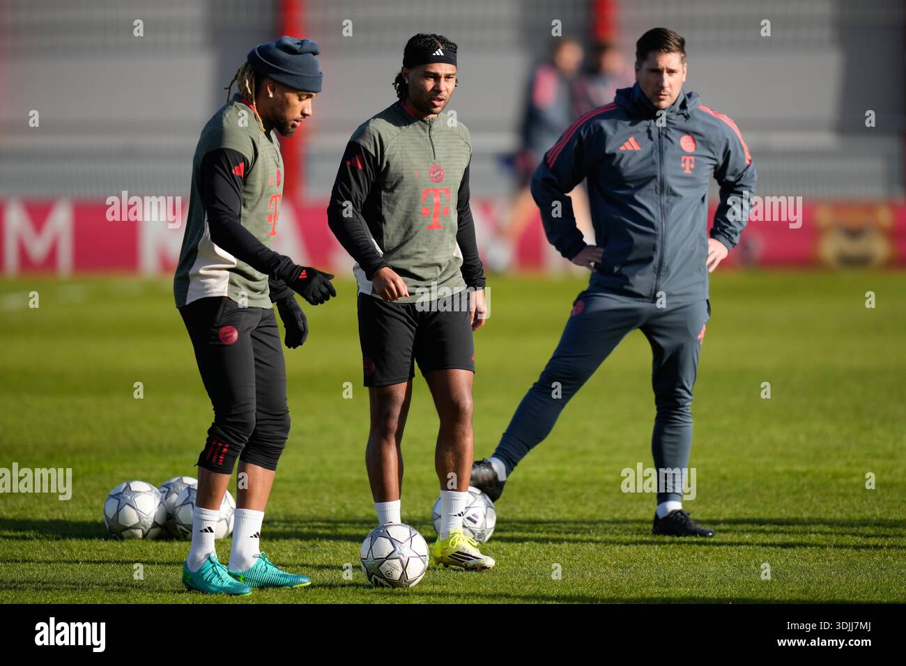 Bayern's Serge Gnabry and Sacha Boey attend a training session in ...