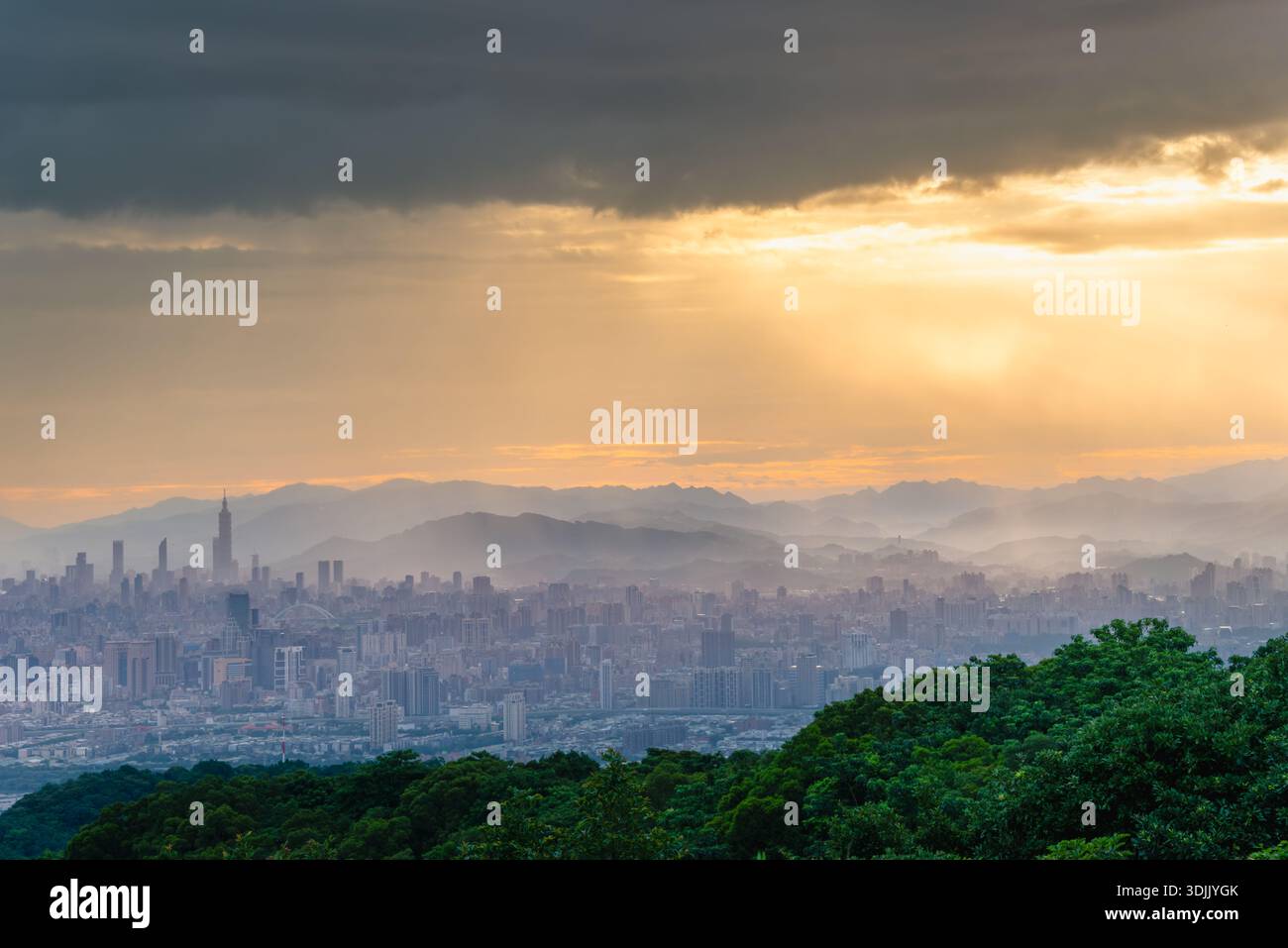 Captures crepuscular rays piercing through clouds and thin rain over ...