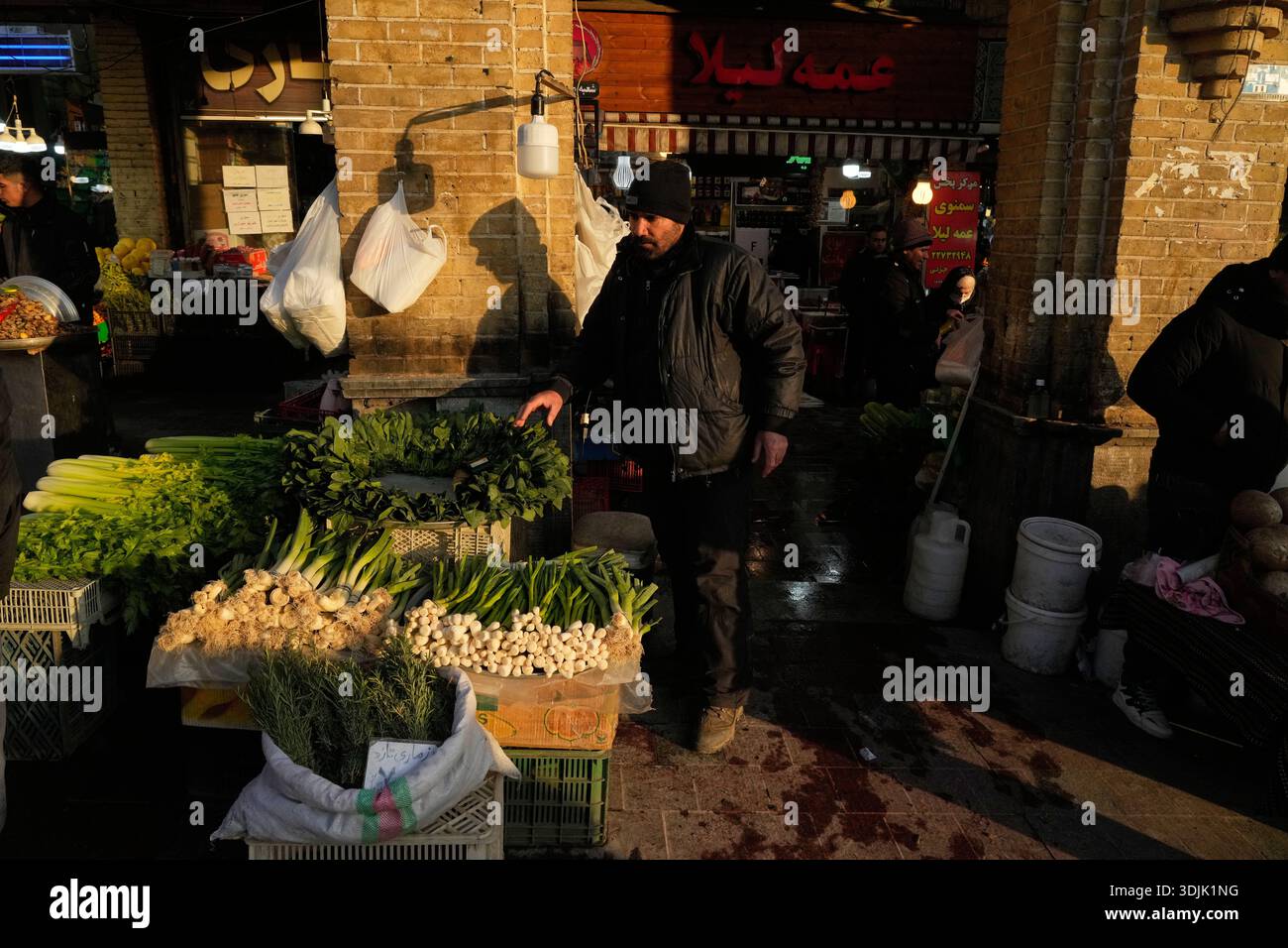 A vendor sells vegetables at Tajrish traditional bazaar in northern ...