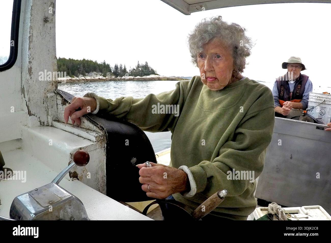 FILE - Virginia Oliver, 101, pilots the boat of her son, Max Oliver ...