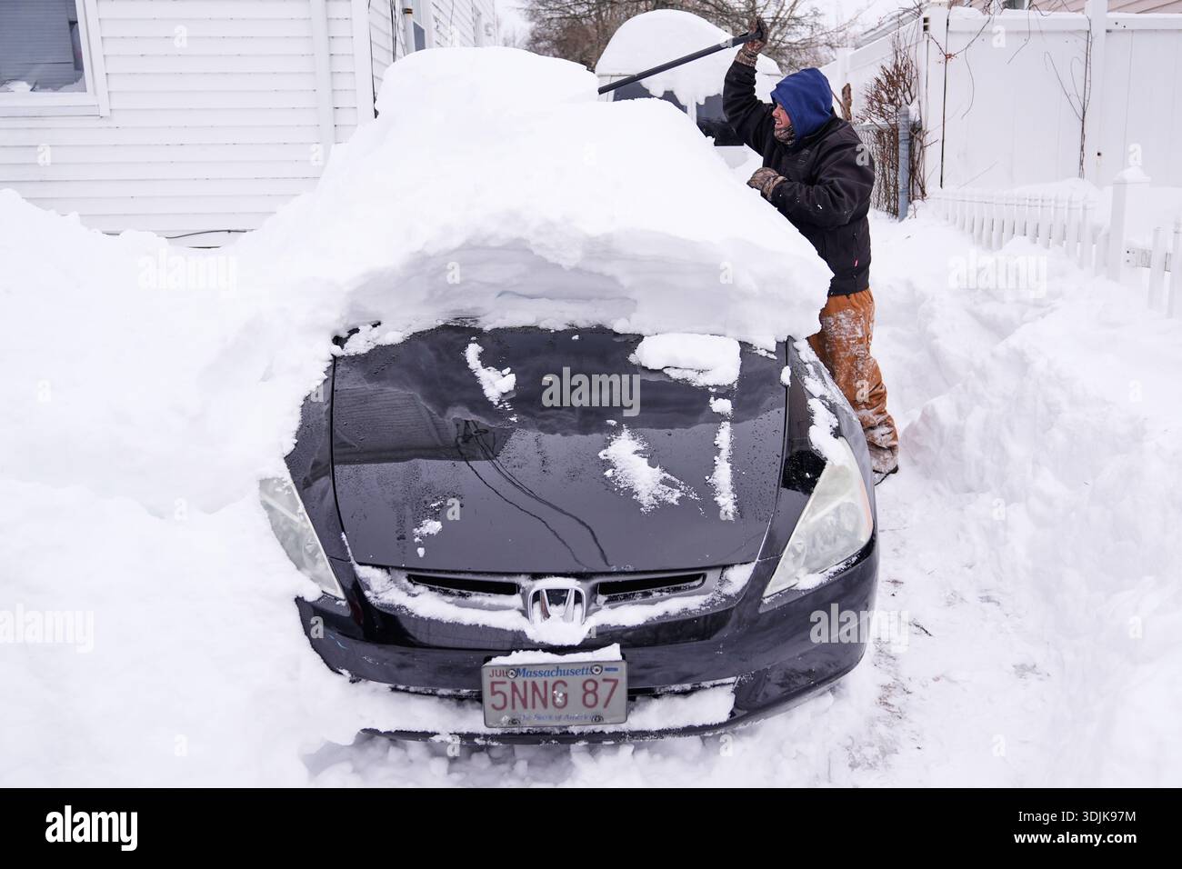 Nathan Ruiz digs out his car encased in many feet of snow following a ...