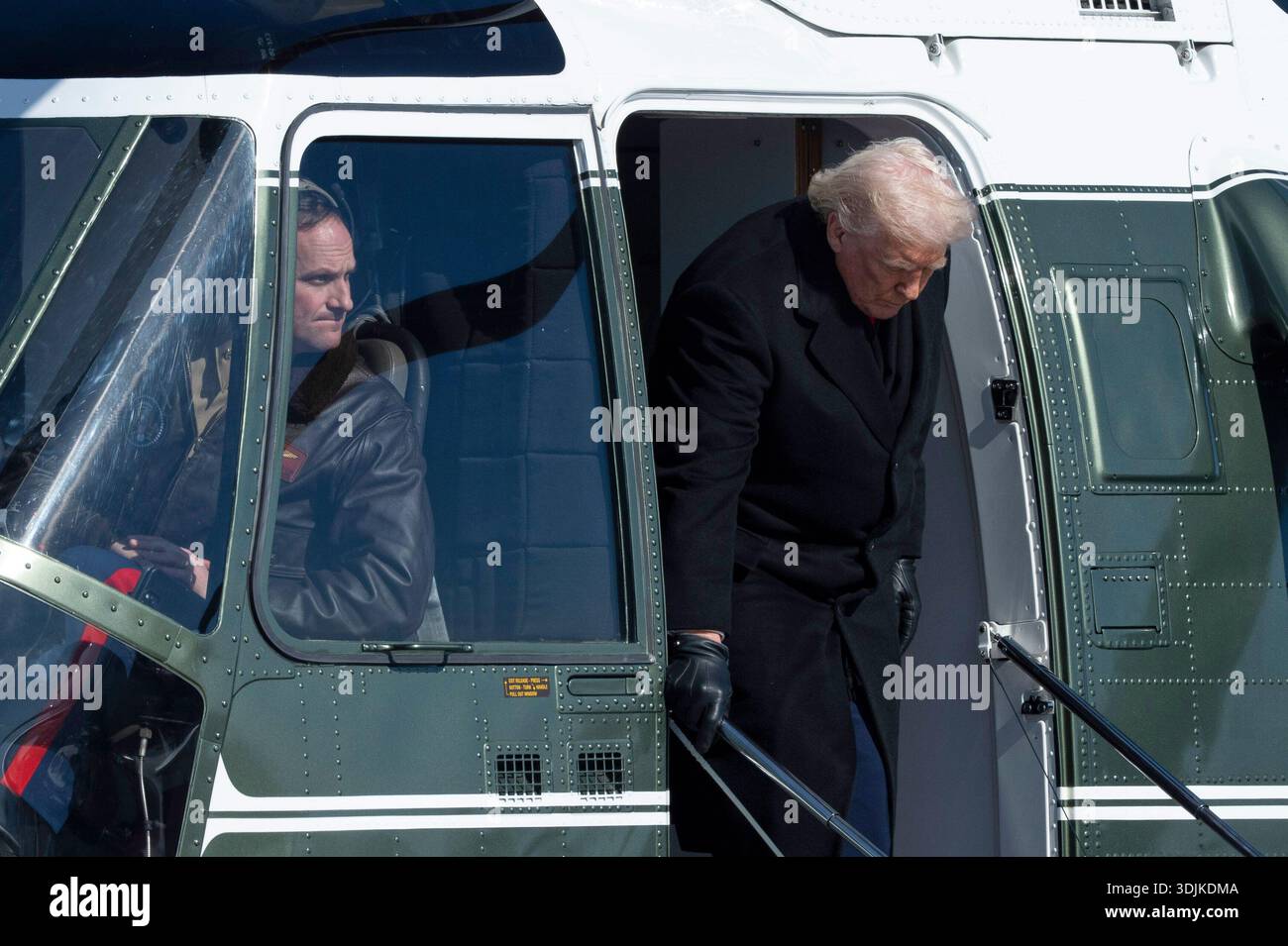 The Marine One pilot watches as President Donald Trump exits the ...